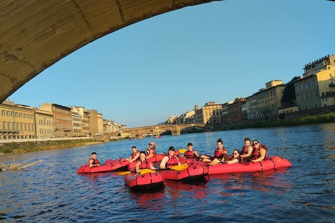 Kayak on the Arno river in Florence under the arches of the Old Bridge