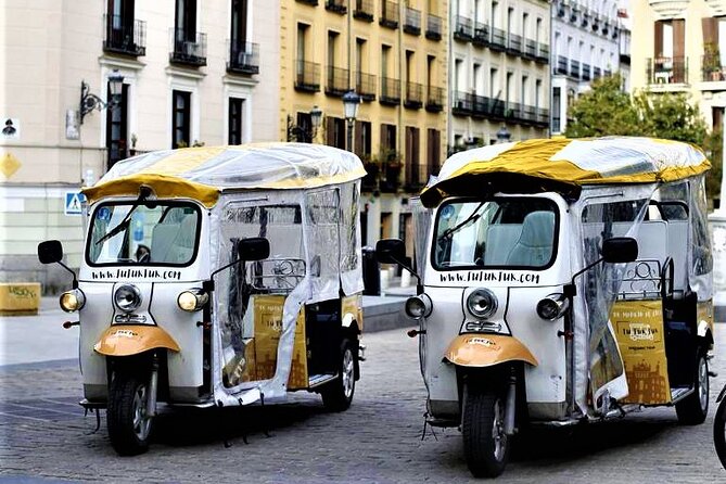 Tour of Historic and Modern Madrid with a guide in a yellow tuk tuk - Discover Madrid’s Contrasts