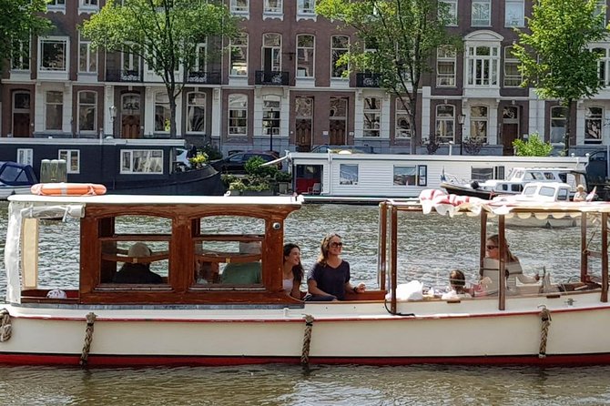 Private canal cruise on small historic boat - An Experience that Combines Comfort, Education, and Style