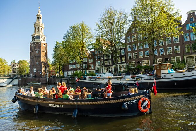 Amsterdam: Guided Open Boat Canal Cruise Including 1 Drink - A Detailed Look at the Itinerary