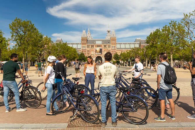 Amsterdam Small-Group Bike Tour With Canal Cruise, Drinks, Cheese - Riding Through Amsterdam: What to Expect