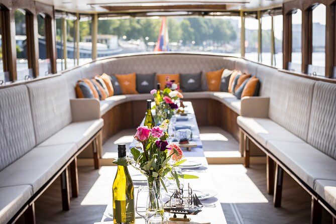 Amsterdam Historic Tour On Classic Saloon Boat - Key Points