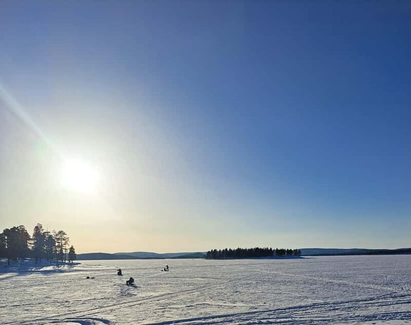 From Saariselkä: Ice Fishing Tour with Open Fire Cooking