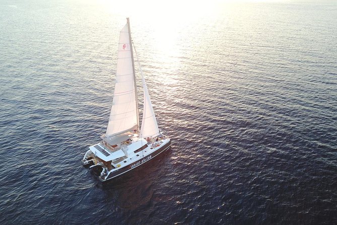 Santorini Luxury Catamaran Sunset Cruise with BBQ, Drink and Transfer - Setting Sail on the Ipanema 58: The Yacht and Its Uniqueness
