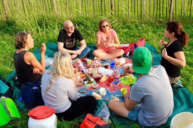 Small-Group Guided Sunset Canoe Tour in Waterland with Dinner - Key Points