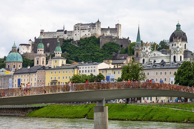 From Vienna: Day Tour to Hallstatt and Salzburg with Boat Ride