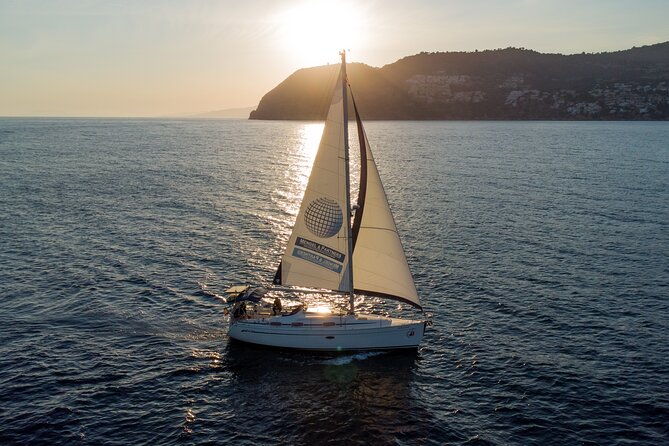 Sailing at sunset along the cliffs of Maro-Compartida - Practical Details & Tips