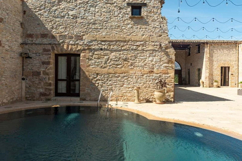 Nature and relaxation by the pool at Baglio Passofondo Estates