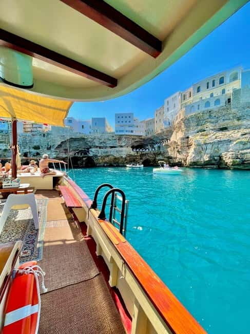 Polignano Monopoli: boat tour on a traditional wooden boat at sunset - What Makes the Itinerary Special