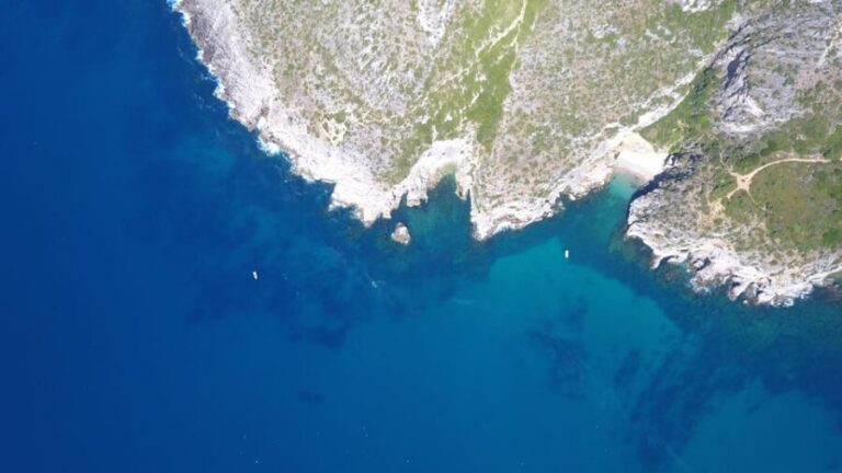 Sesimbra: Boat Trip to the wild beaches and caves - The Sum Up