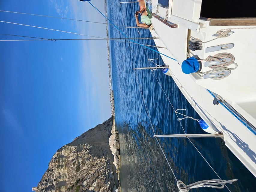 Cagliari gulf boat tour, sailing, snorkeling and drink.